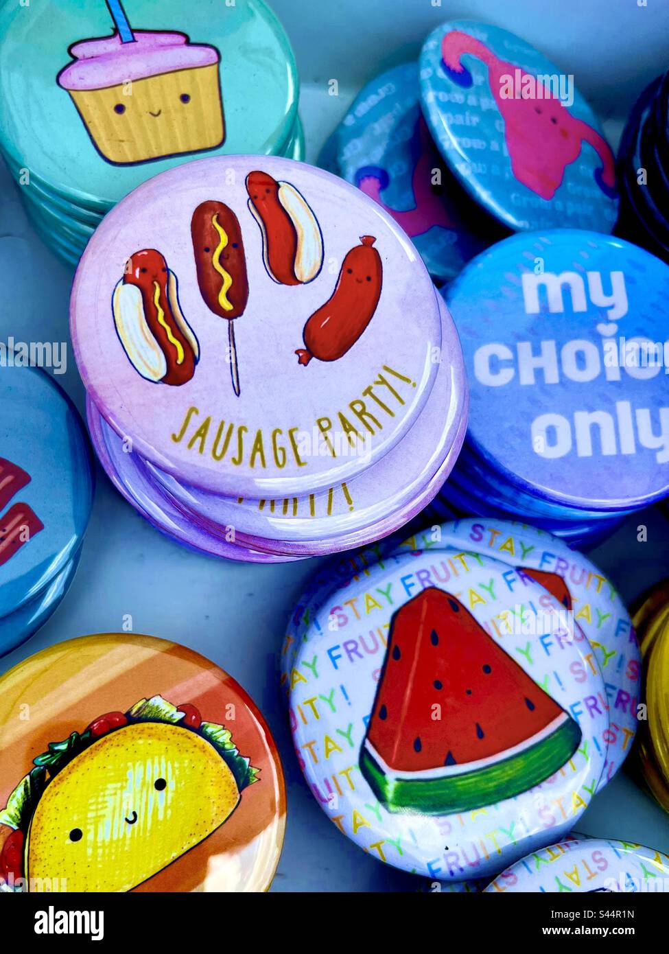 Gender bending buttons. Feminist and Sausage Party Stock Photo - Alamy