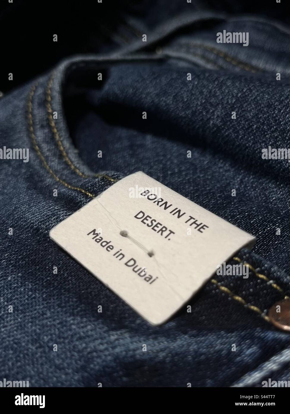 Blue jeans tag born in the desert, made in Dubai Stock Photo - Alamy