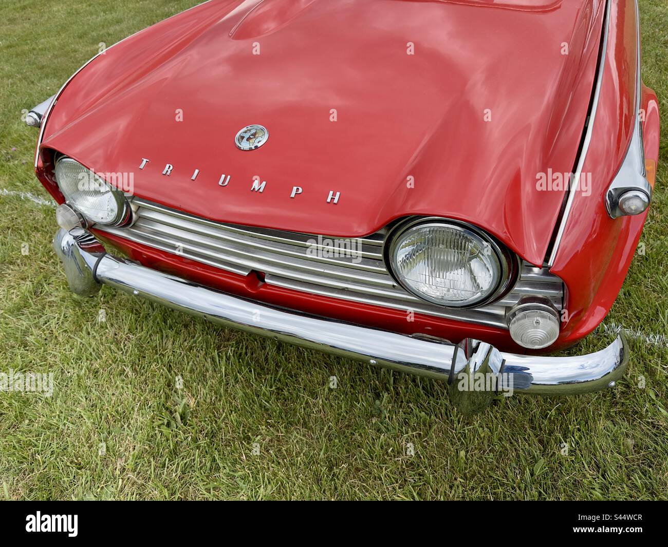 Front of red 1965 Triumph car. British, classic vehicle Stock Photo - Alamy