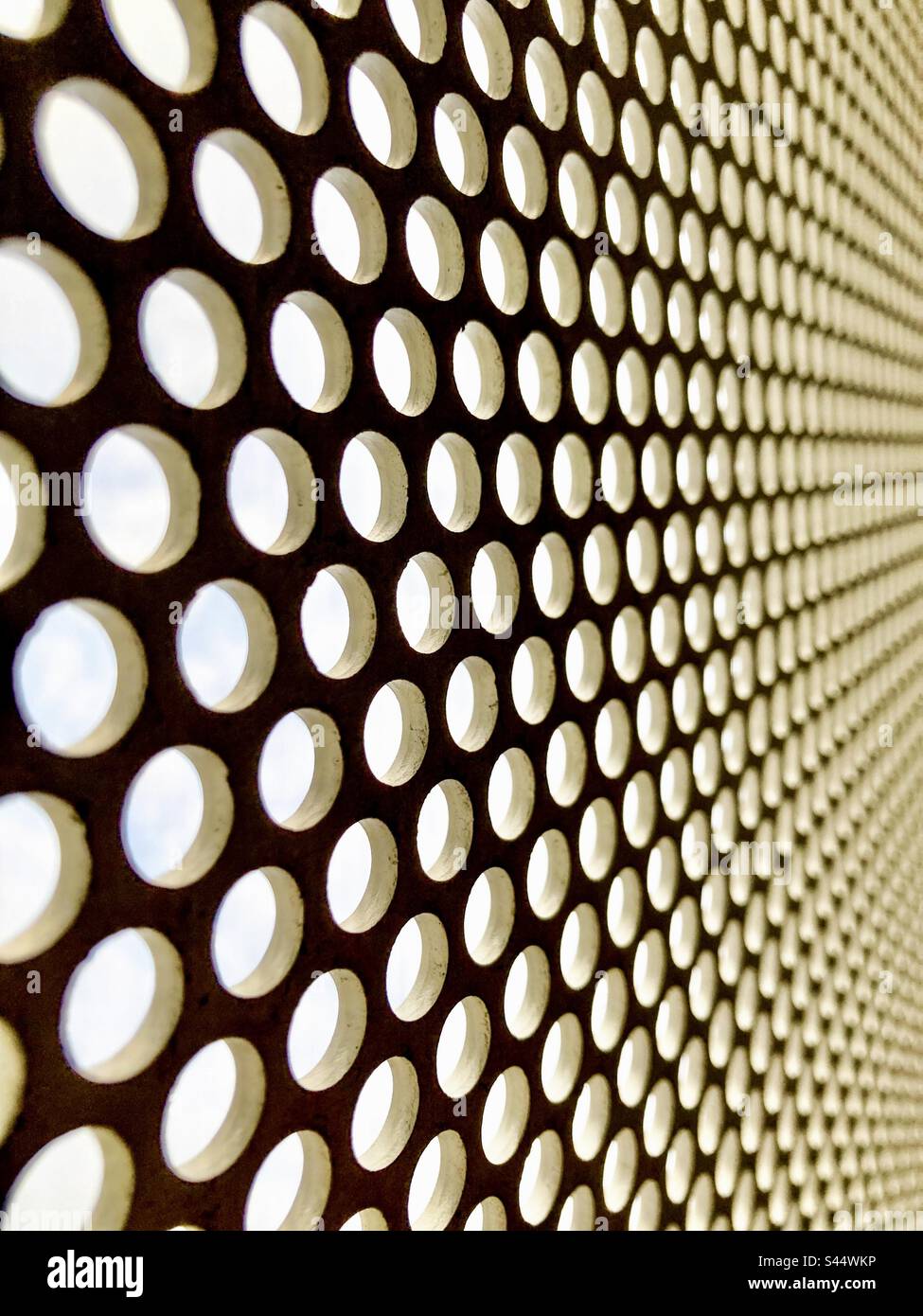 Abstract hole punched steel Stock Photo - Alamy