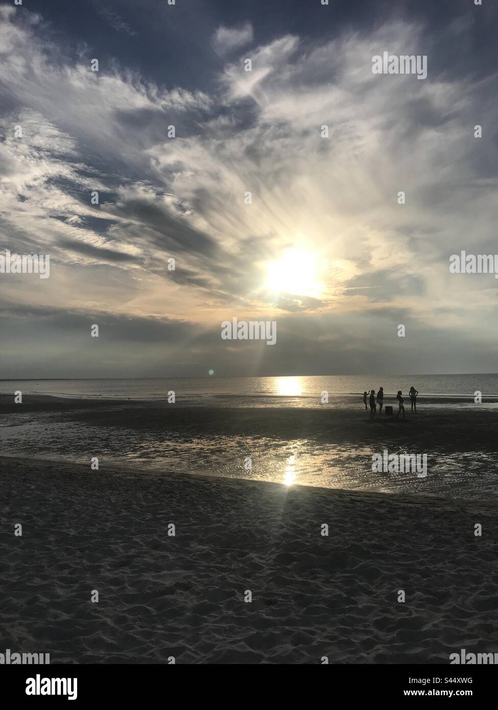 Cape Cod sunset lights up the sky, ocean, and tidal pools as the clouds ...