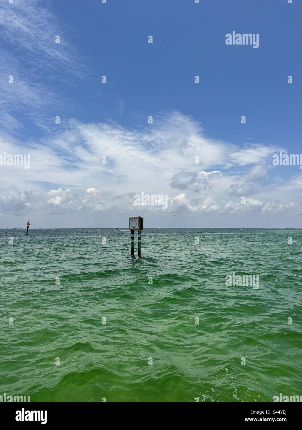 Boat view of the emerald green water at Crab Island Destin, Florida ...