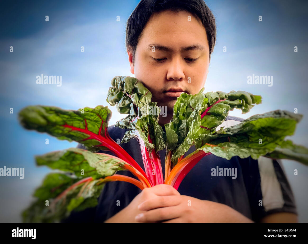 Man holding bunch flowers hi-res stock photography and images - Alamy