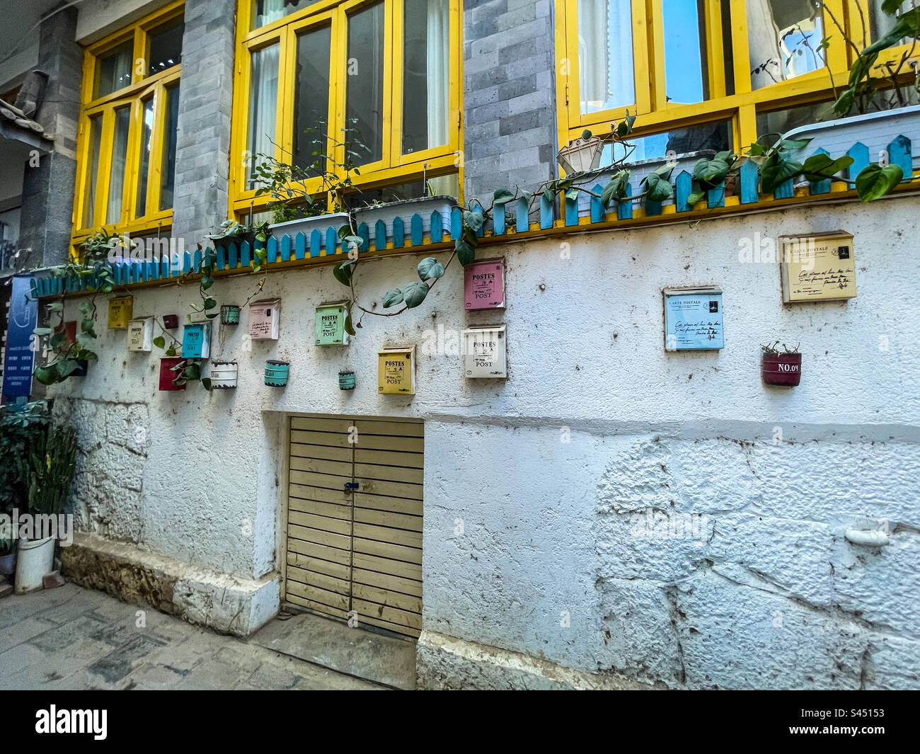 Mailboxes on a wall Stock Photo - Alamy