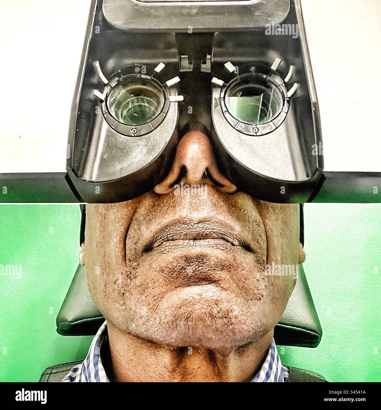 Afro Caribbean male having an eye test Stock Photo - Alamy