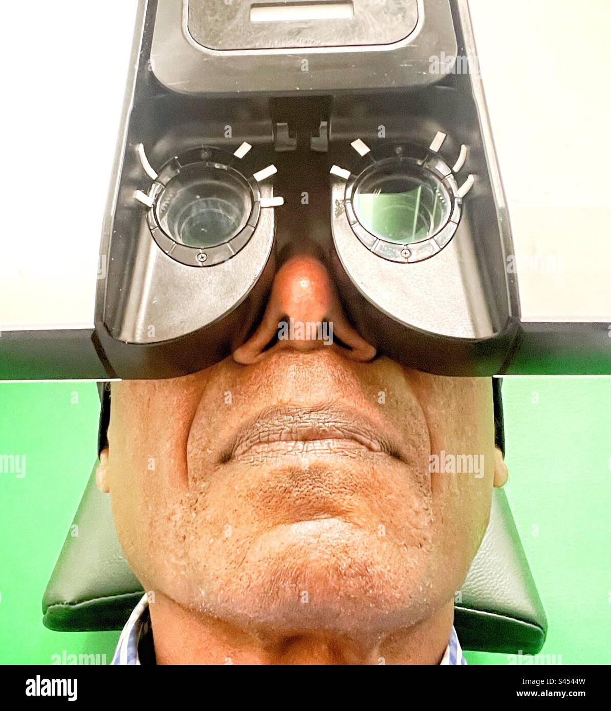 A Black male having an eye test Stock Photo - Alamy