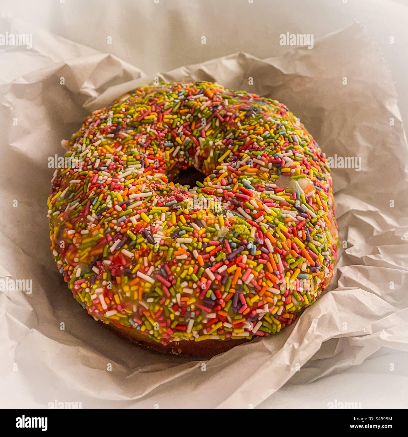 Hundreds & thousands donut Stock Photo - Alamy
