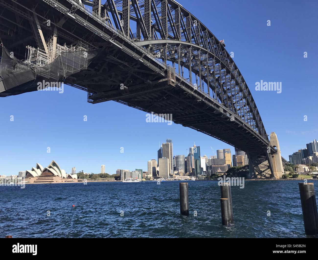 A picture of the Sydney Harbour Bridge with the skyline and opera house ...
