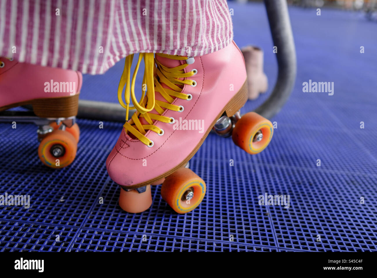 Getting ready to roller skate at the roller rink Stock Photo - Alamy