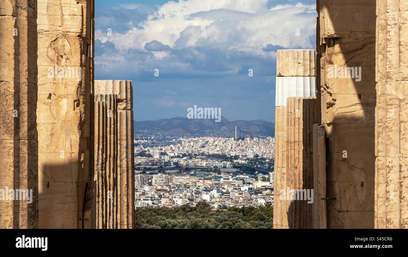 View of Athens, Greece through the columns of the Acropolis Stock Photo ...