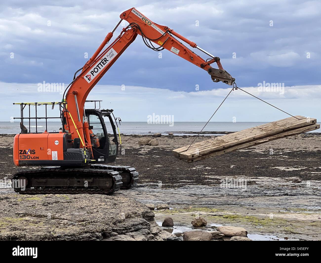Telehandler at work on a beach Stock Photo - Alamy