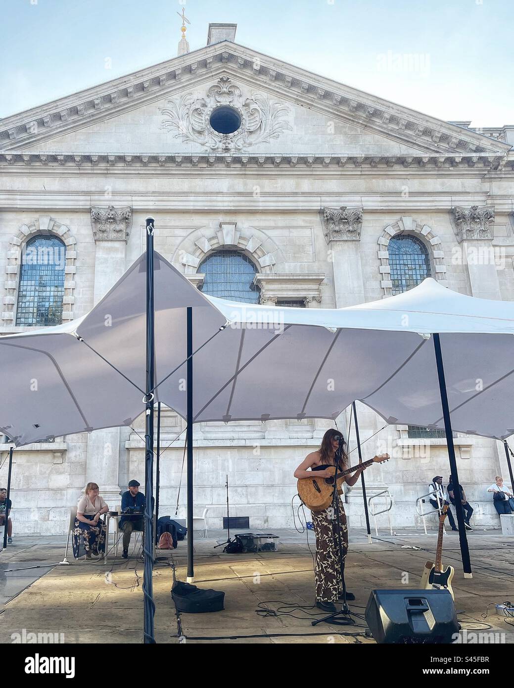 Rachel Croft sings outside St Martin in the Fields Church in London as ...
