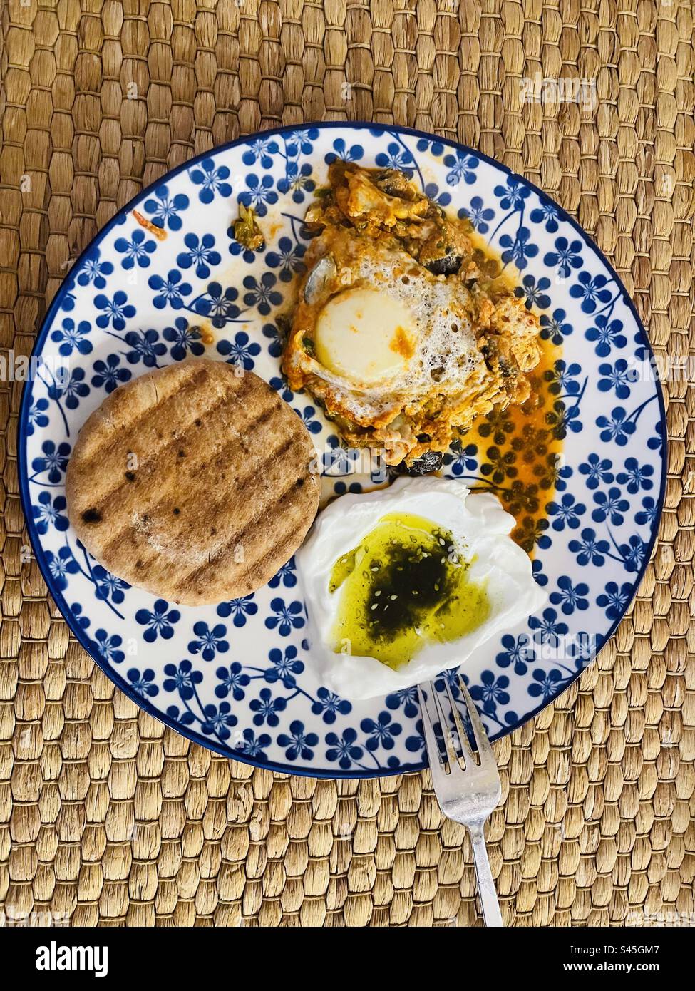 A plate of Shakshuka with Labane and pita Stock Photo - Alamy