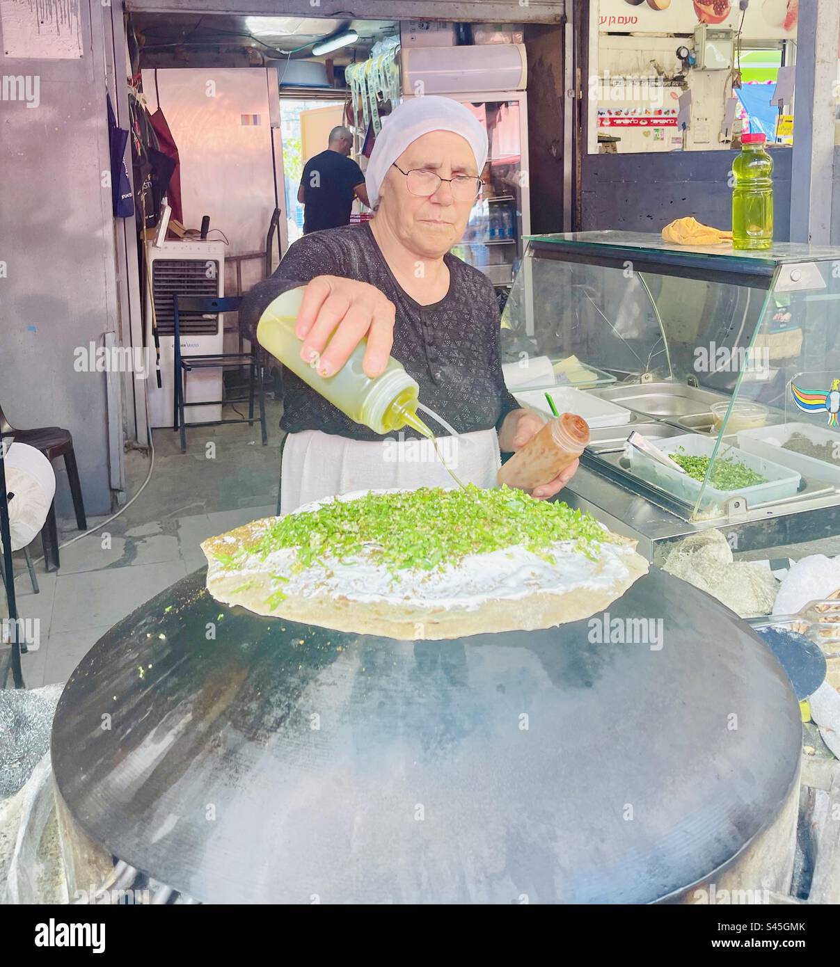 A Druz woman preparing traditional bread Stock Photo - Alamy