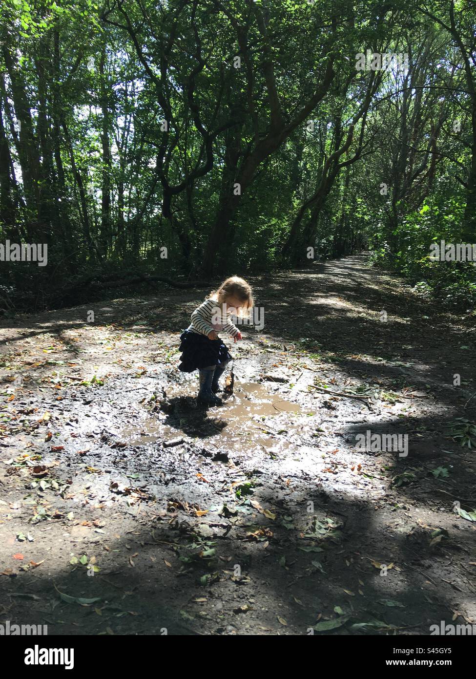 Child wearing boots hi-res stock photography and images - Alamy