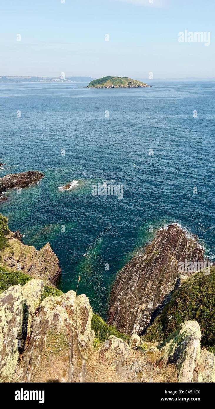 Looe island as seen from the South west coast path on a hot summer day ...