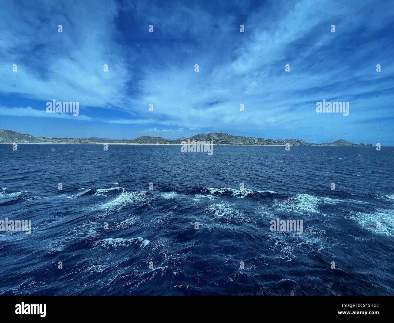 Ocean view with island at a distance Stock Photo - Alamy