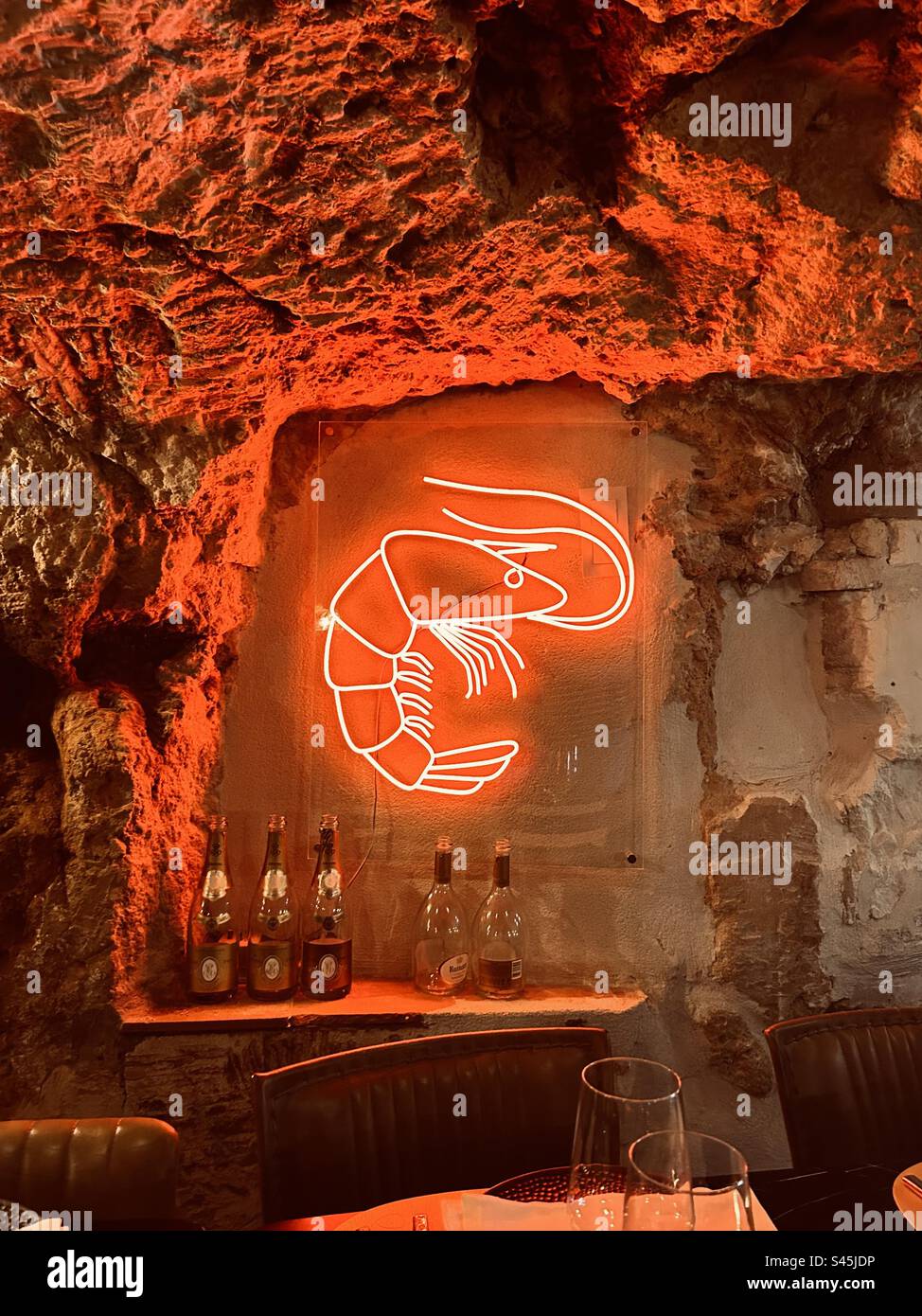 Neon shrimp in a cave bar in menorca Stock Photo - Alamy
