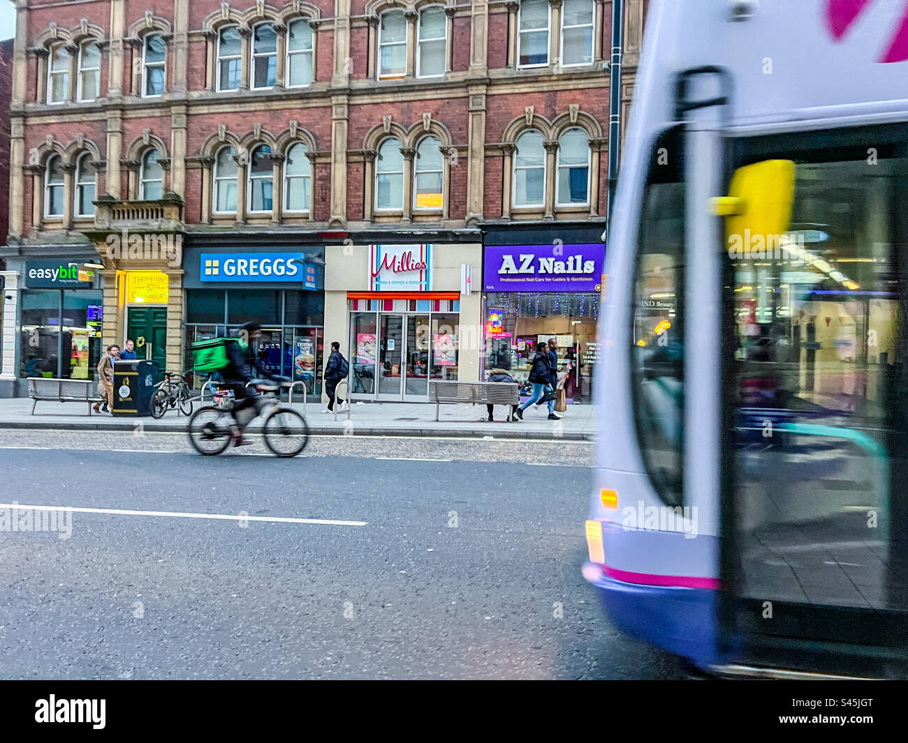 Busy street scene on the Headrow in Leeds City Centre Stock Photo - Alamy