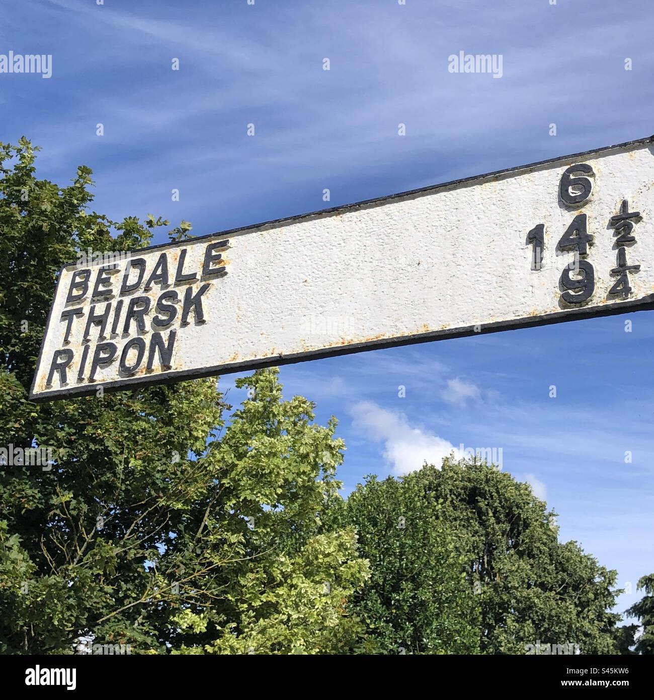 An old fashioned metal road traffic sign post in Masham, North ...