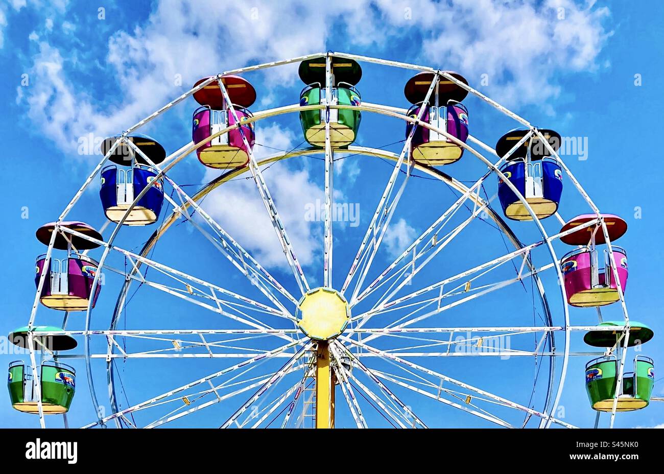 Colourful Ferris Wheel in the summer sun Stock Photo - Alamy