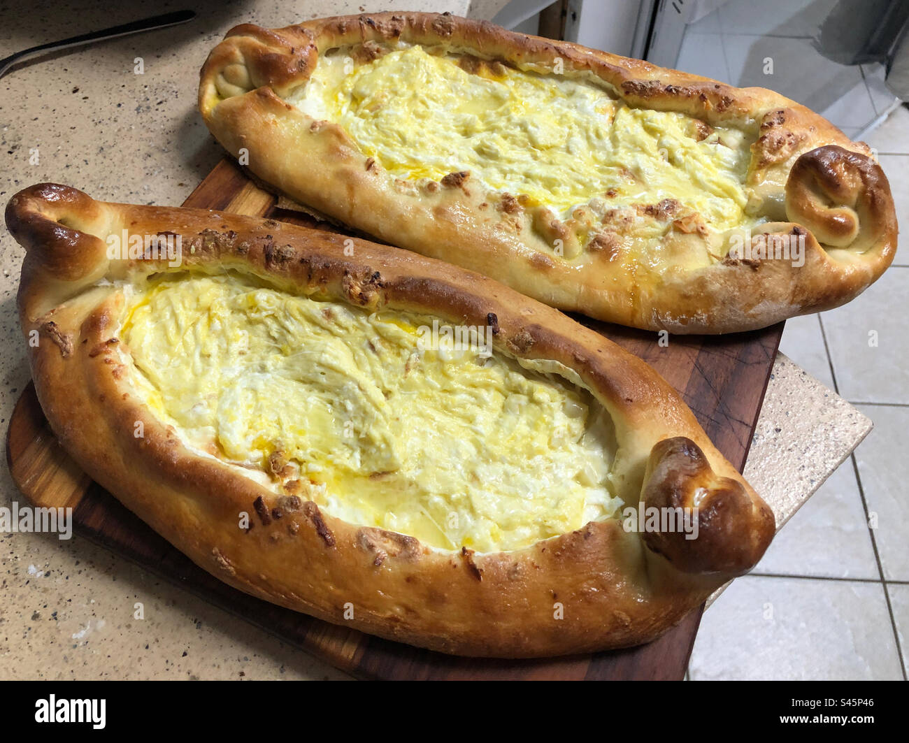 Georgian cheese bread (Kachapuri) with the eggs mixed into the cheese ...