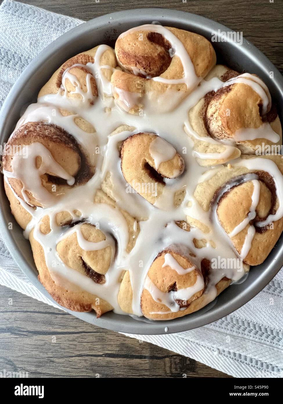 Cinnamon rolls in a round baking pan Stock Photo - Alamy
