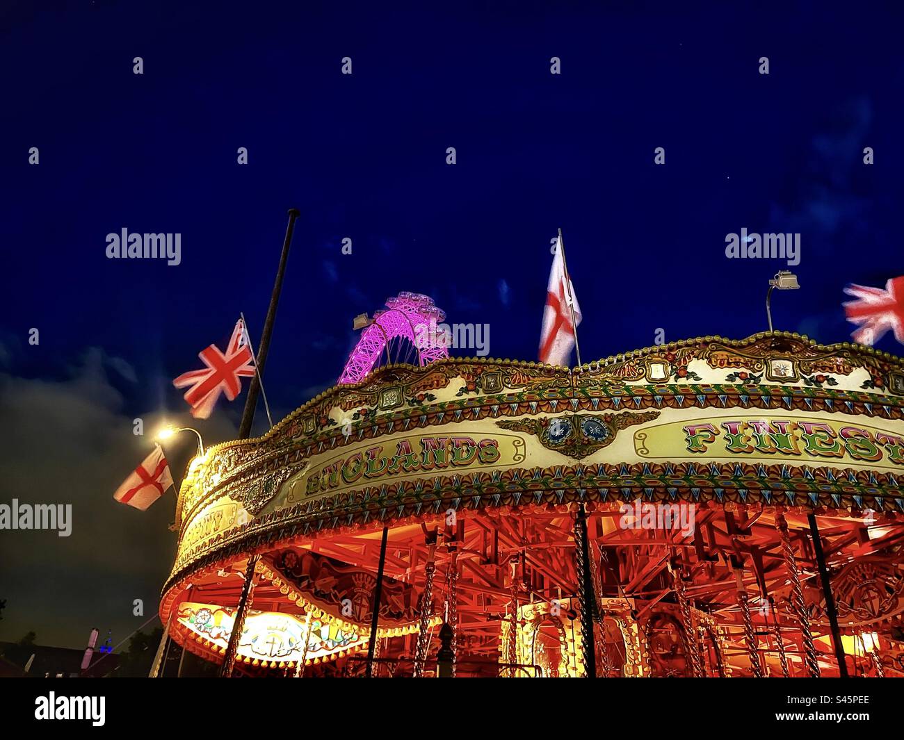 Carousel and London Eye, Ferris Wheel on the south bank of the river ...