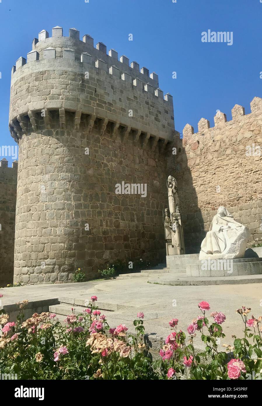 Statue in Spain, Europe with a garden infront and a building with ...