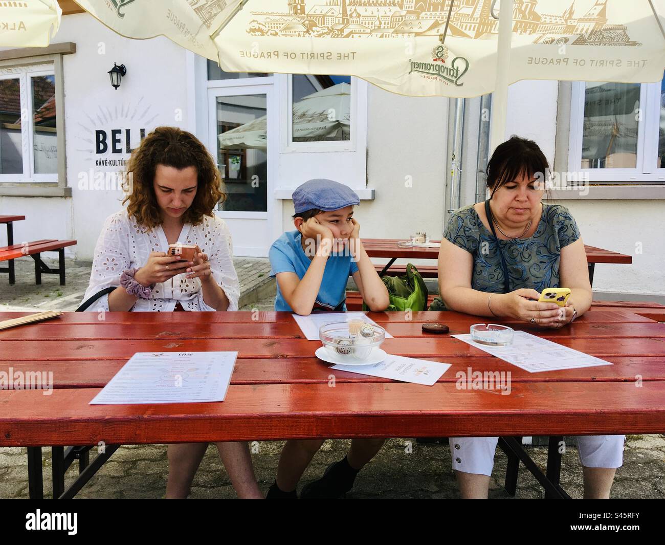 Family with cell phones child bored hi-res stock photography and images ...