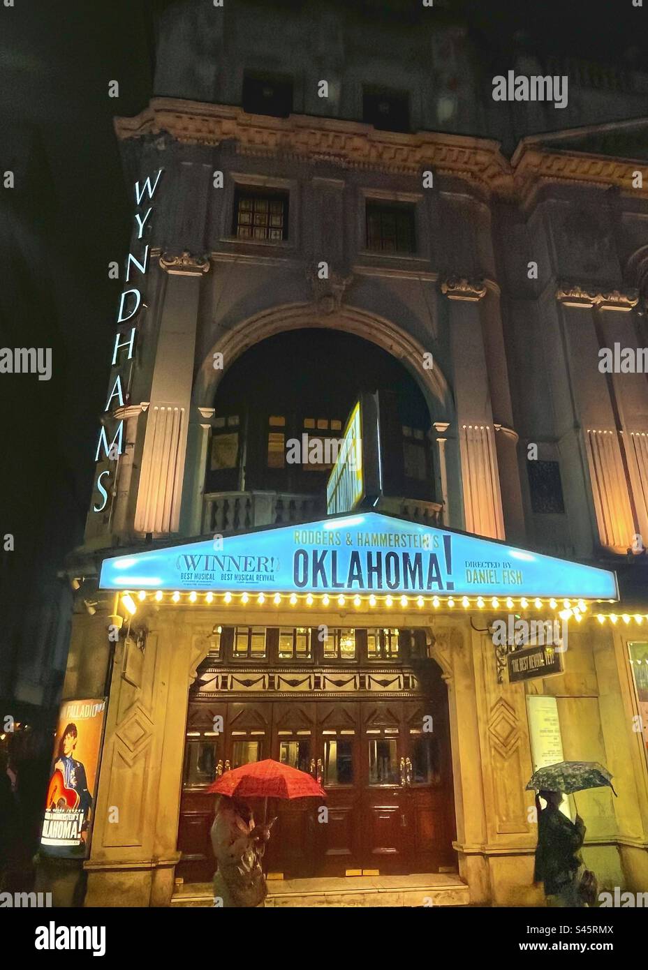 Wyndham Theatre main entrance at night advertising Oklahoma! Lights and ...