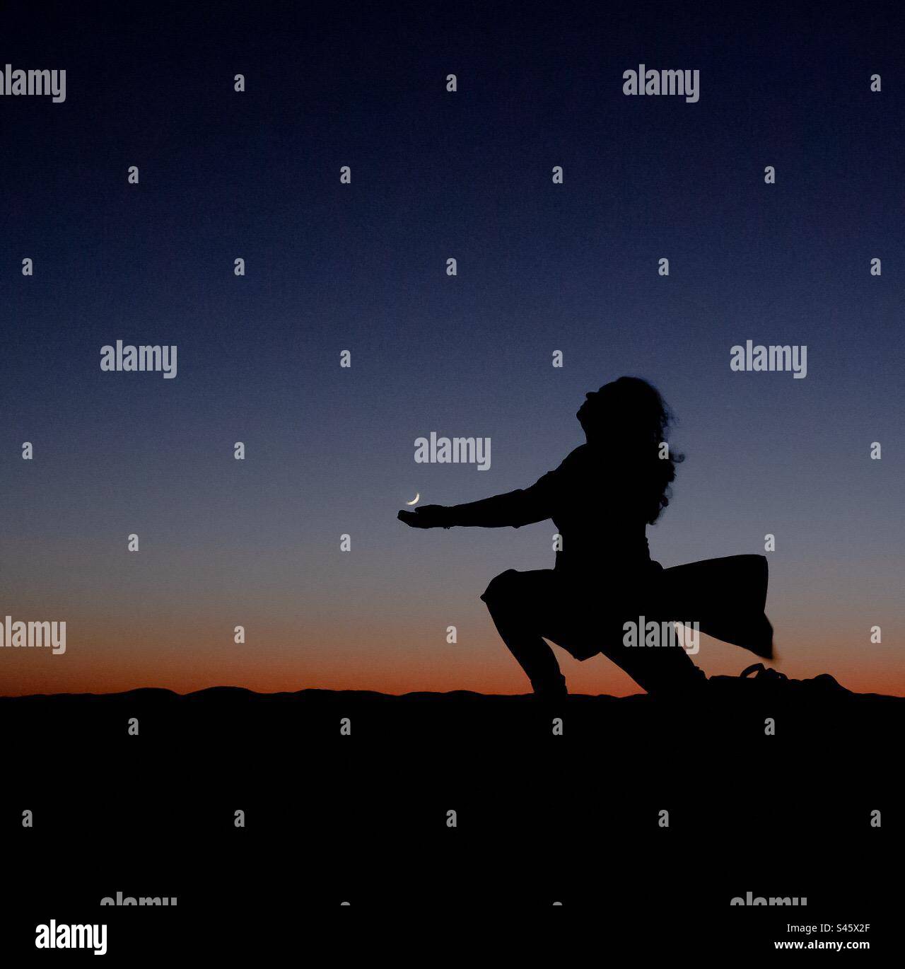 Catching the moon: an Indian dancer performing at sunset with the moon ...