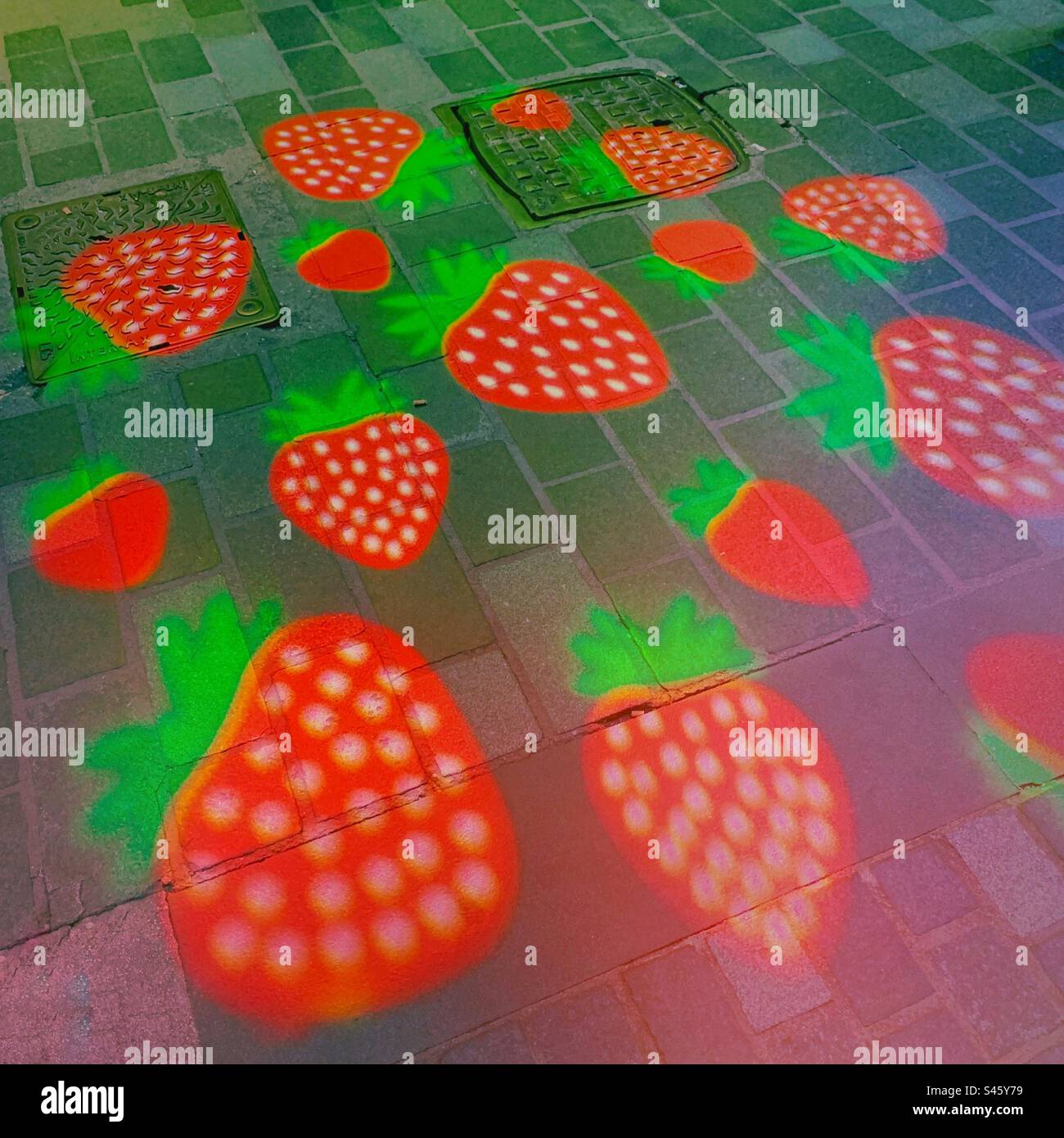 Strawberries projected onto the pavement in Mathew Street the famous ...