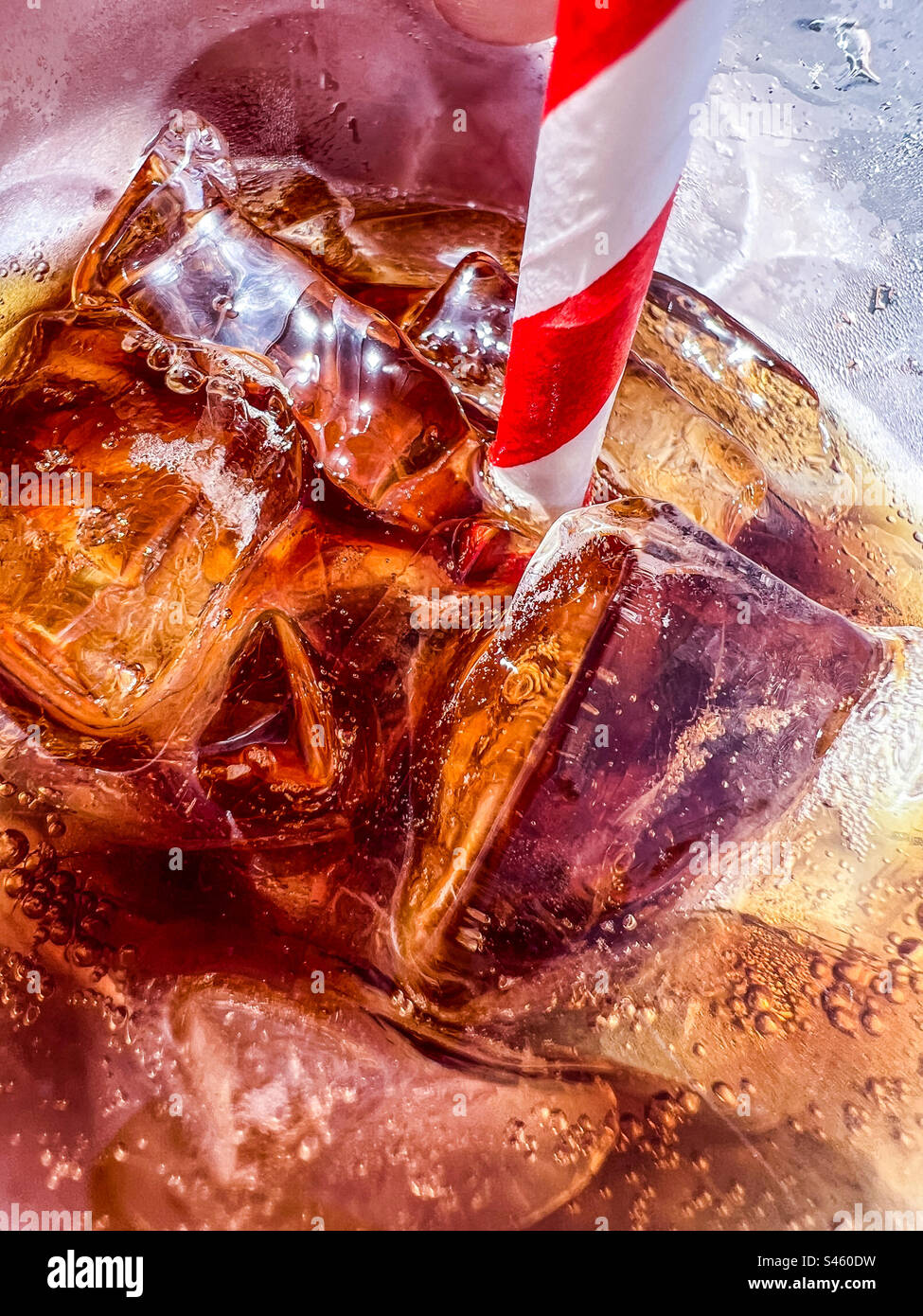 Cola and ice cubes in glass Stock Photo - Alamy