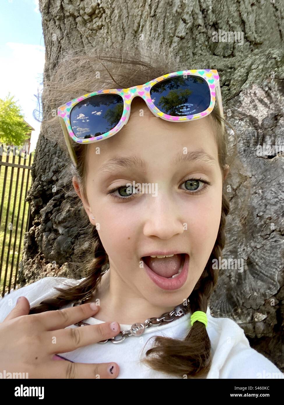 Child girl brown eyes smartphone stock photos and images - Alamy