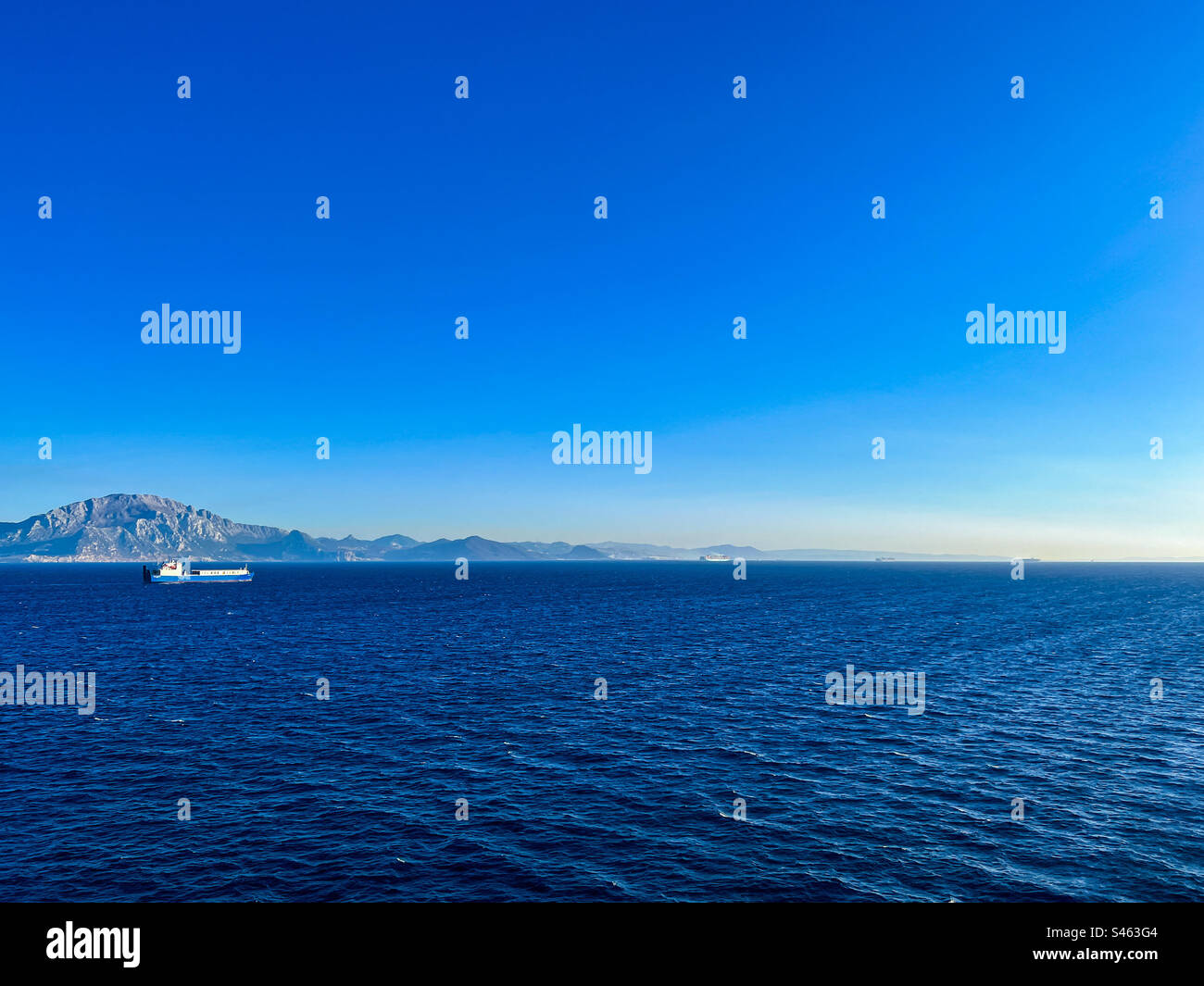 Container ship on the Strait of Gibraltar in summer Stock Photo - Alamy