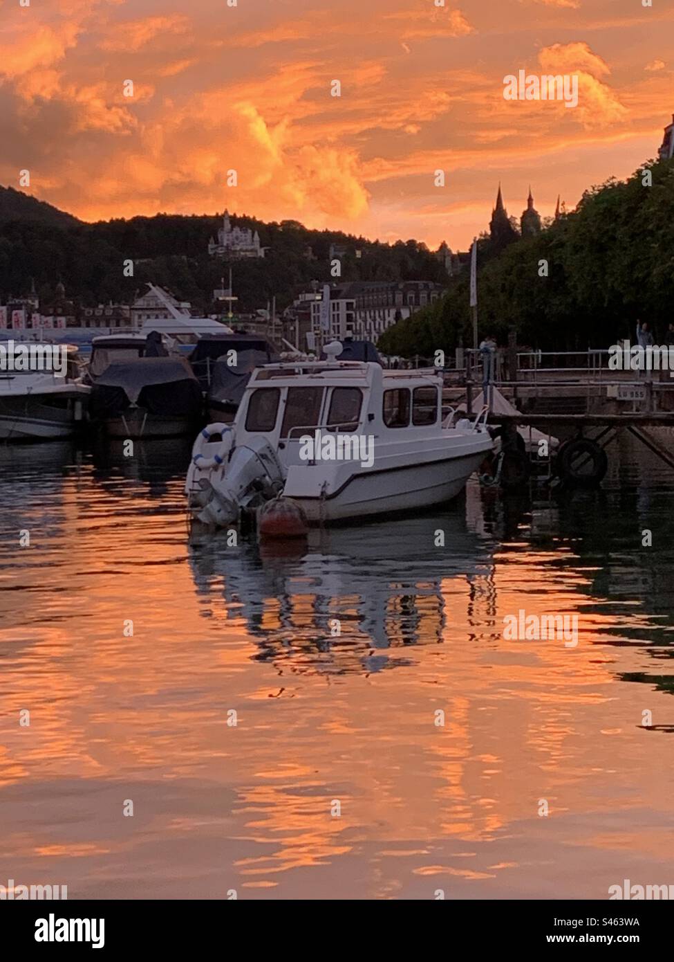 Sunset on lake Lucerne with boats Stock Photo - Alamy