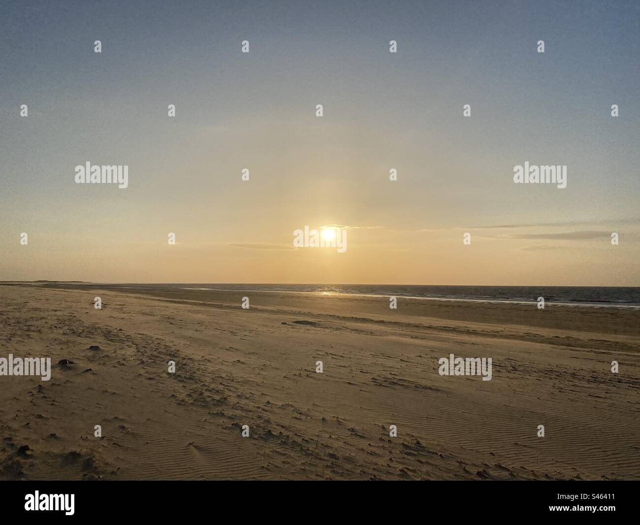 Sunset over UK beach Stock Photo - Alamy