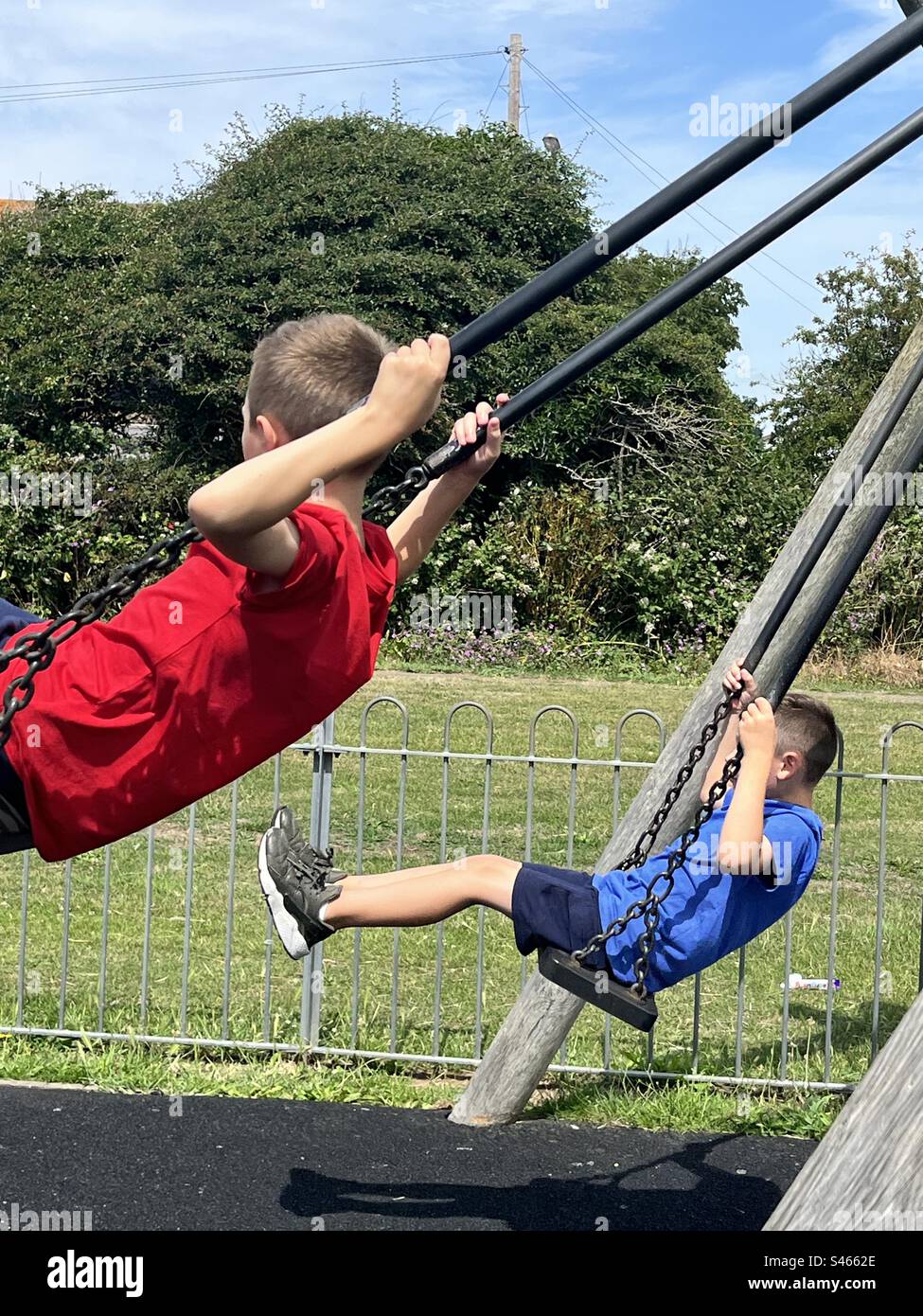 Play on swings hi-res stock photography and images - Alamy