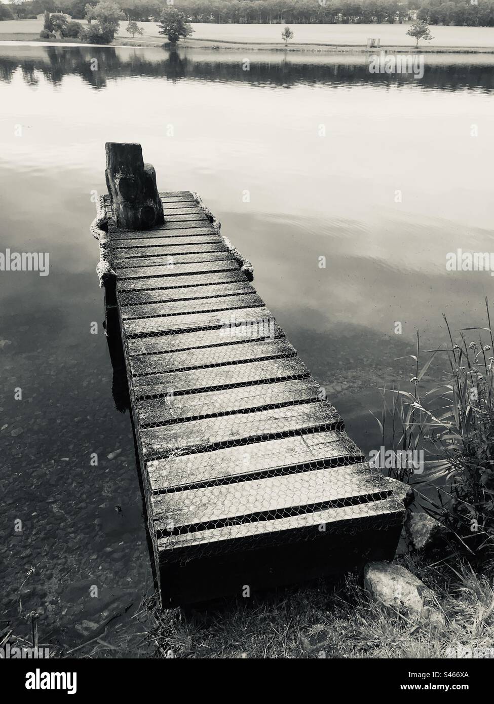 Black and White boat jetty on Lake Stock Photo - Alamy
