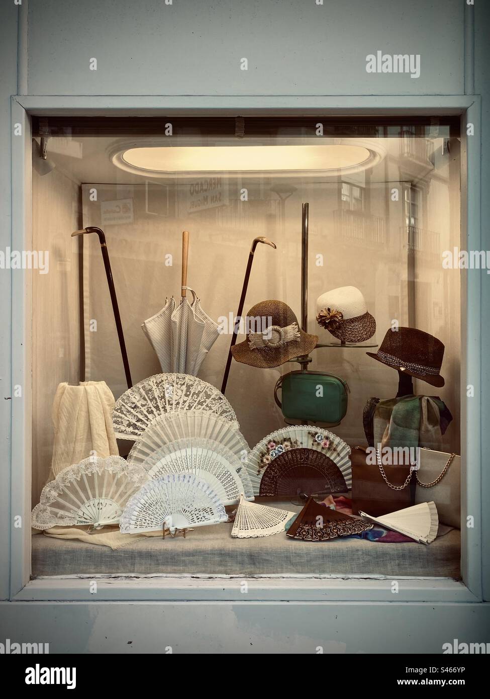 Vintage window display of fans, hats, umbrellas and bags Stock Photo ...