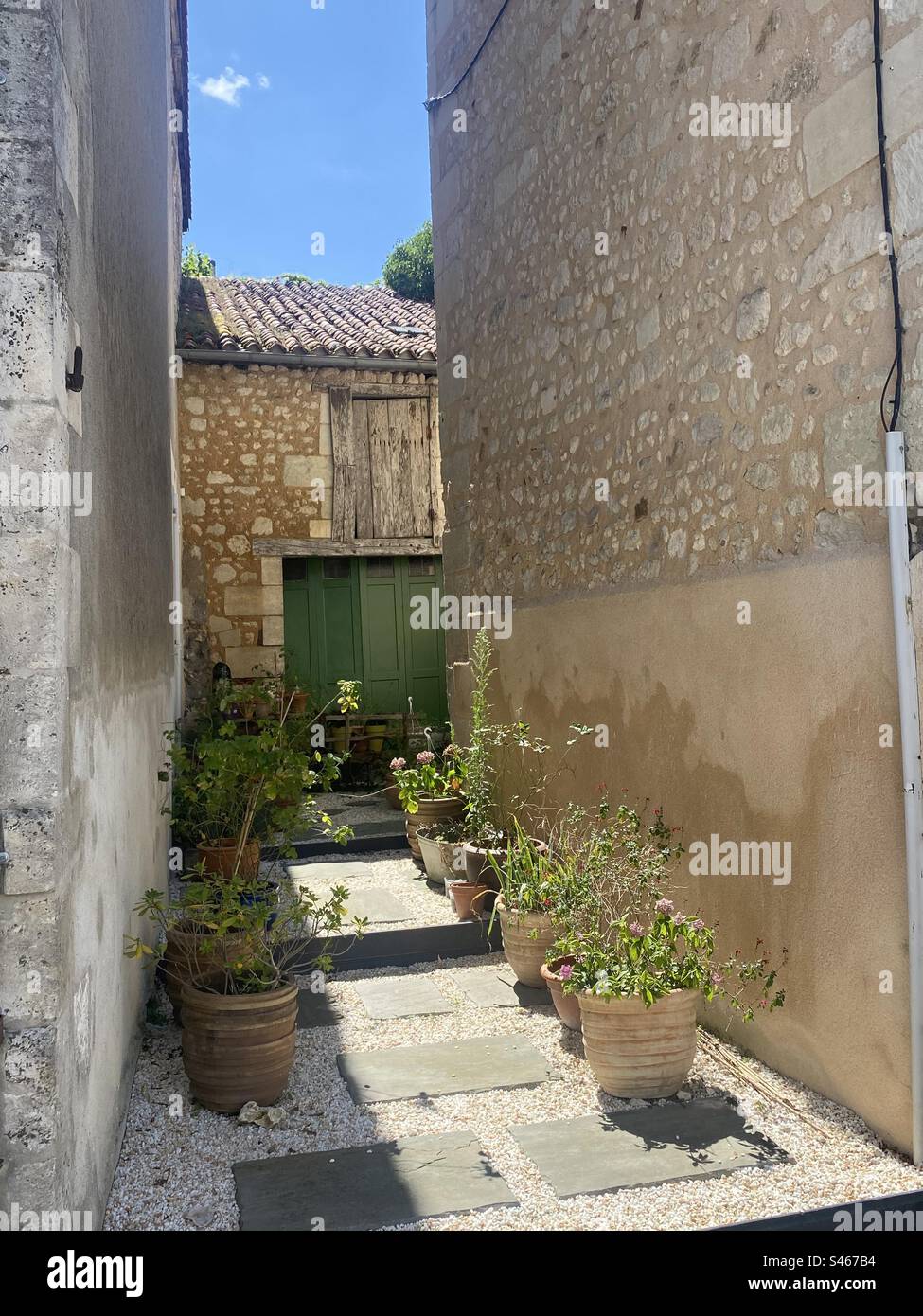 Beautiful Rustic public courtyard in Aubeterre-sur-Dronne, France Stock ...