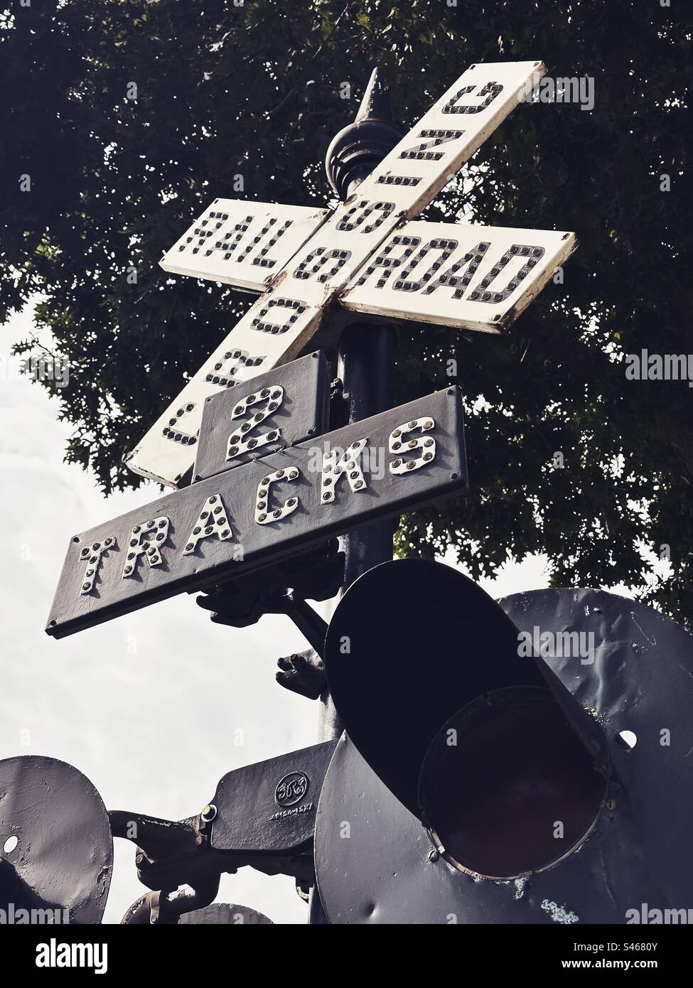 Old-fashioned railroad crossing sign with light below. Connecticut, New ...