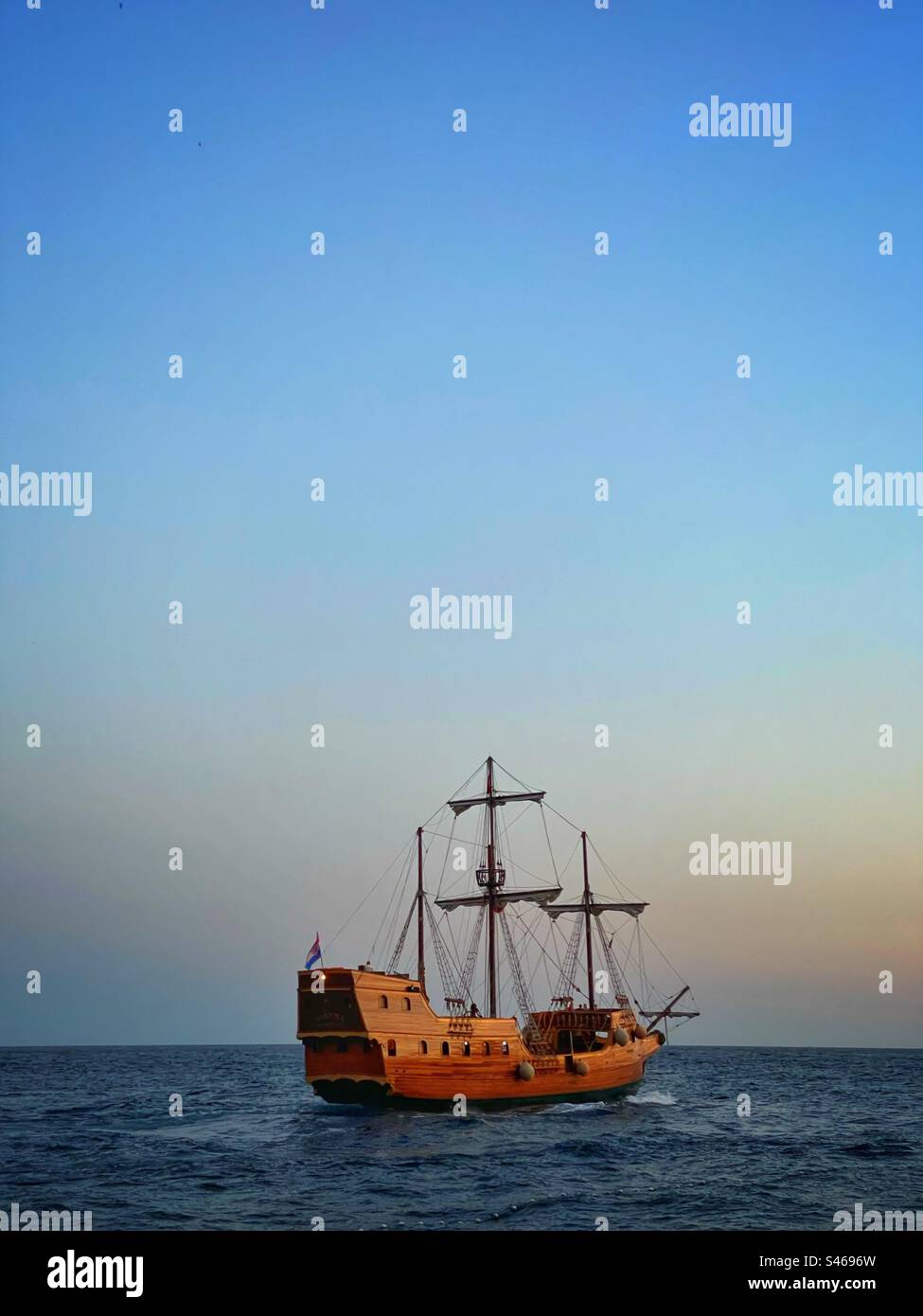 Game of Thrones style old ship sailing past the old town of Dubrovnik ...