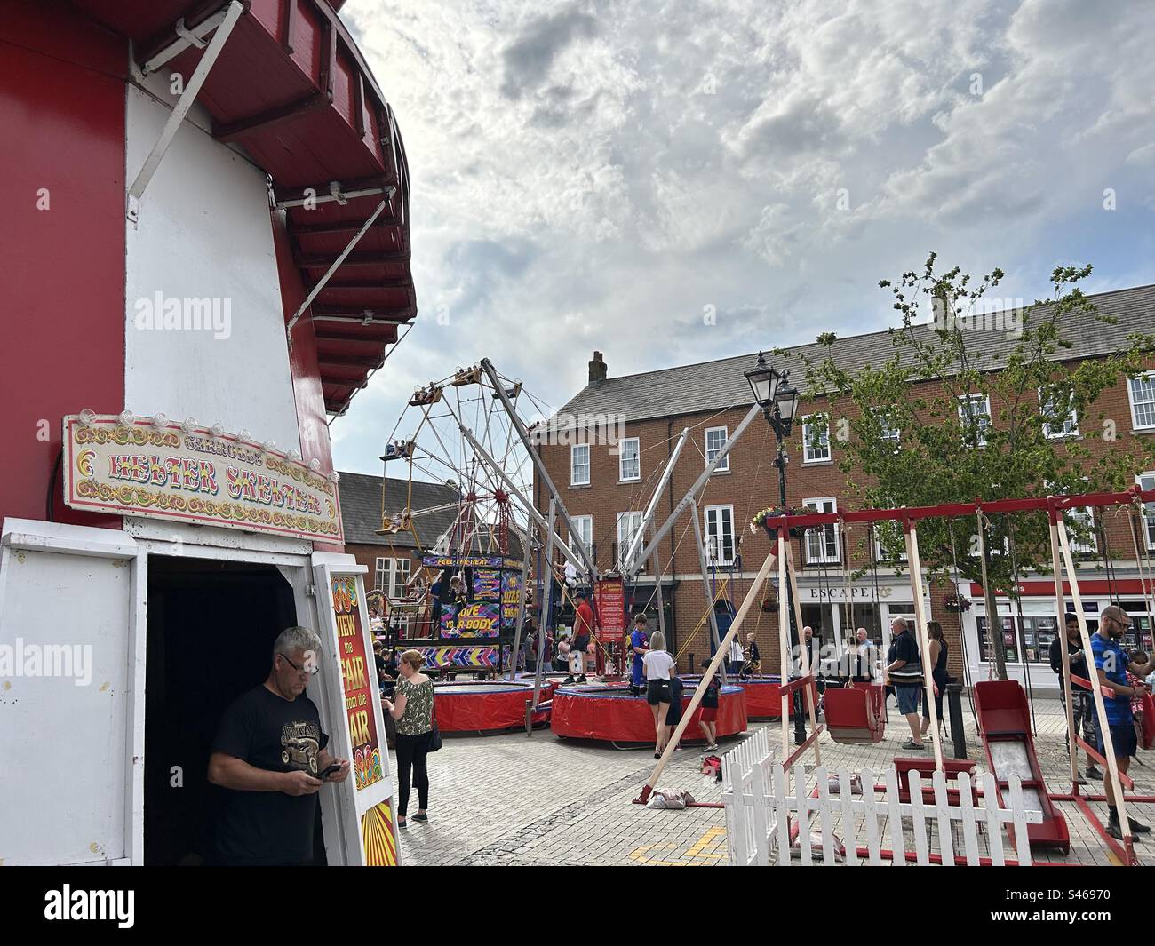 Fairground rides in the town square hi-res stock photography and images ...