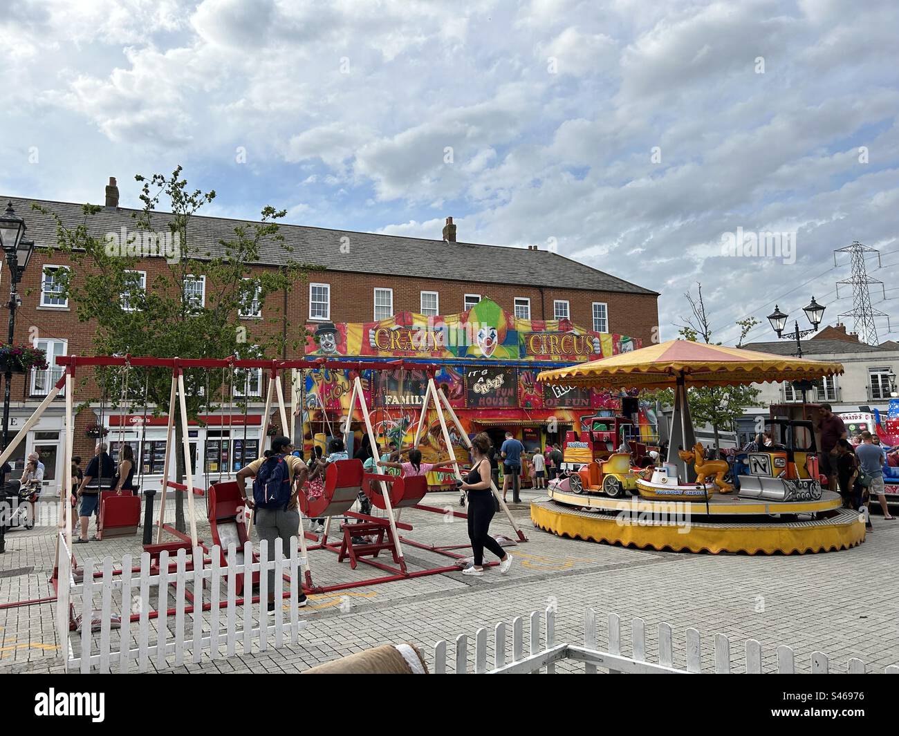Fairground rides in the town square hi-res stock photography and images ...