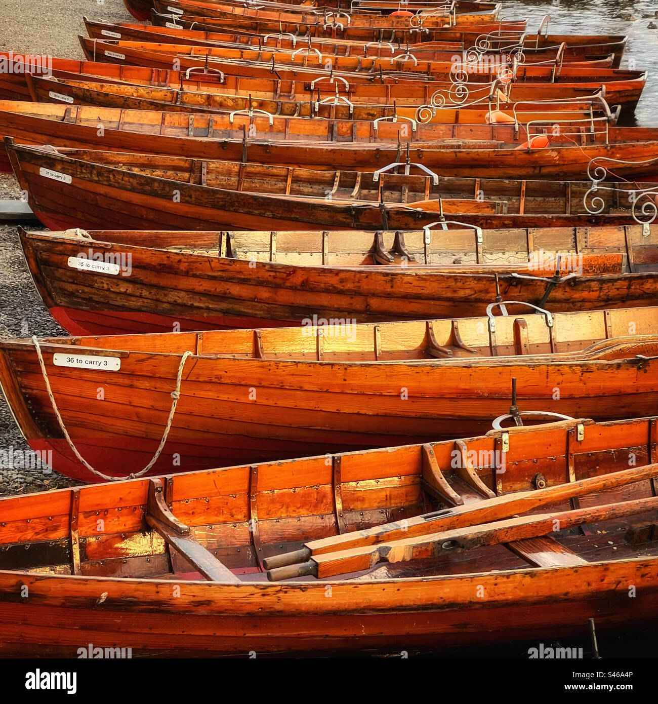Rowing boats beached on Lake shore at Keswick in the Lake District ...