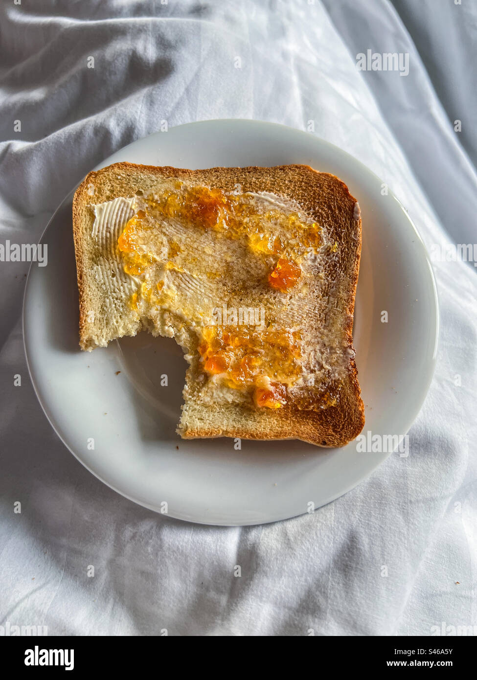 Marmalade on toast with bite Stock Photo - Alamy