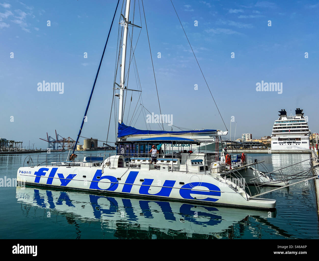 Fly blue catamaran boat in Malaga bay in Spain Stock Photo - Alamy
