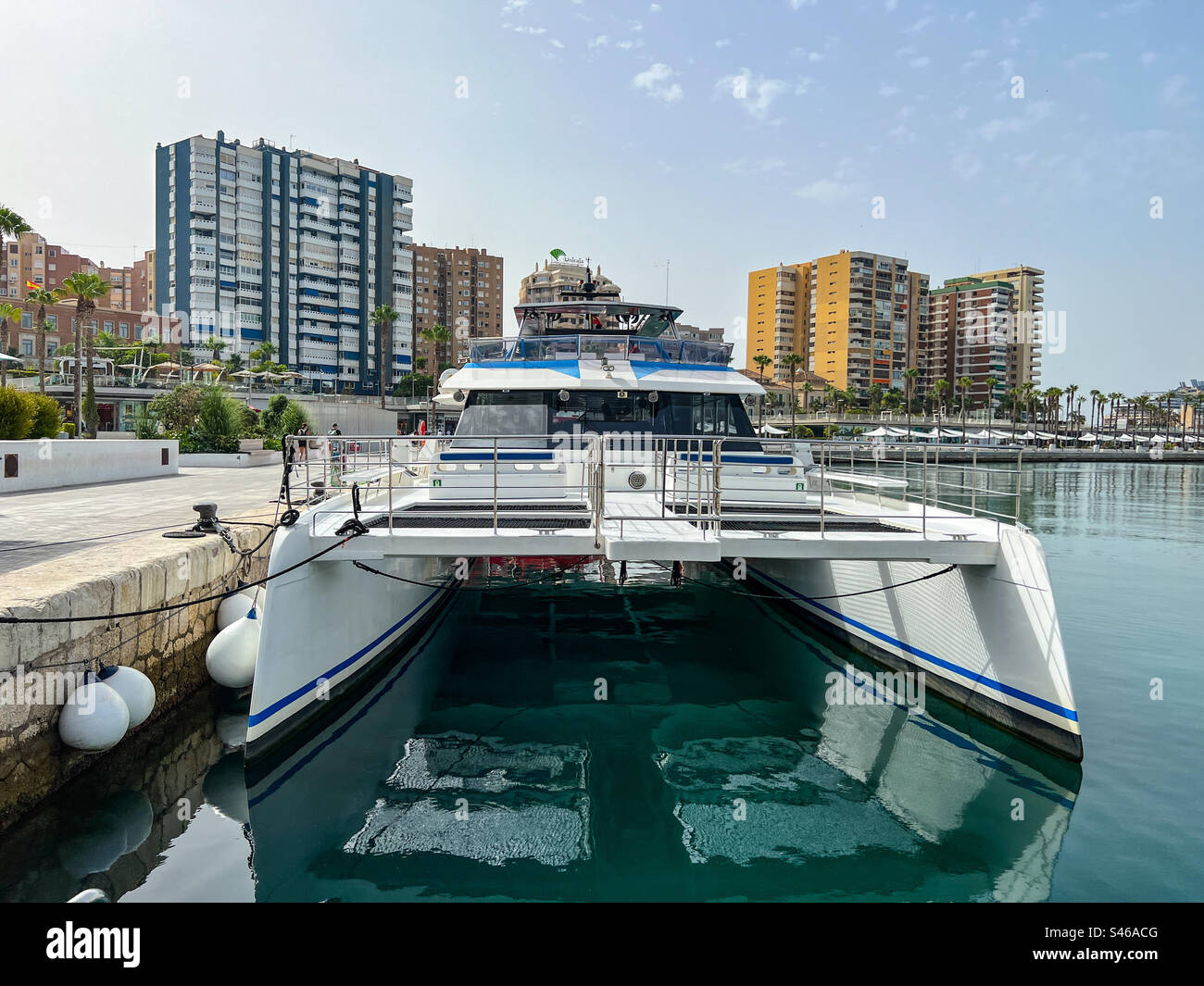 Catamaran boat in Malaga port in Spain Stock Photo - Alamy